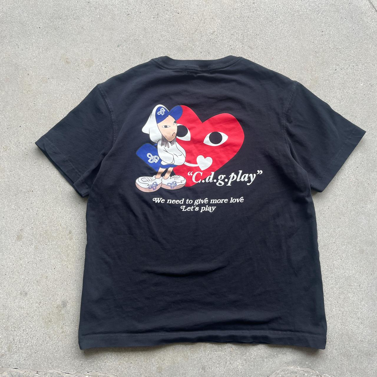 CDG T-shirt with a graphic on the back in perfect... | Depop