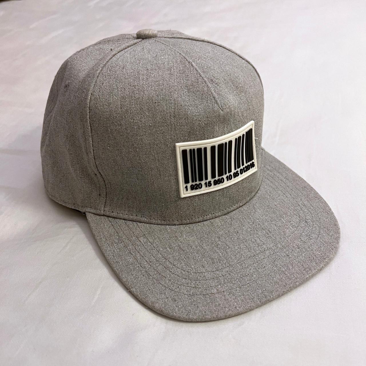 grey adjustable snapback cap with black and white... - Depop