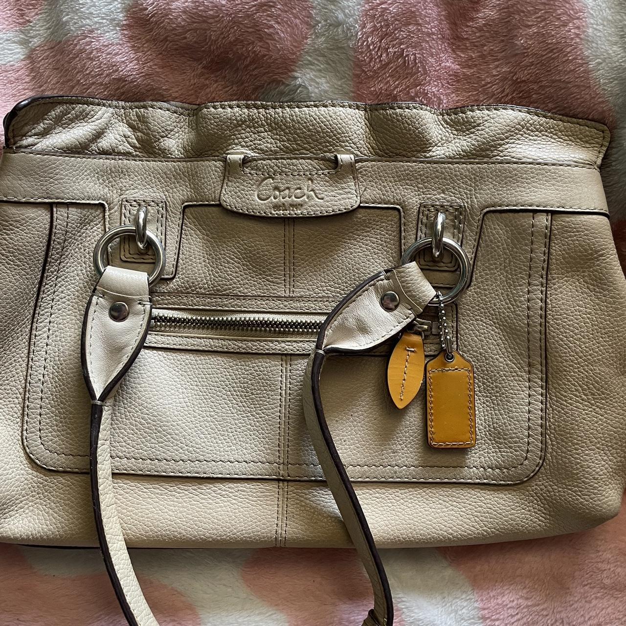 Tan Coach bag with pink lining - Depop