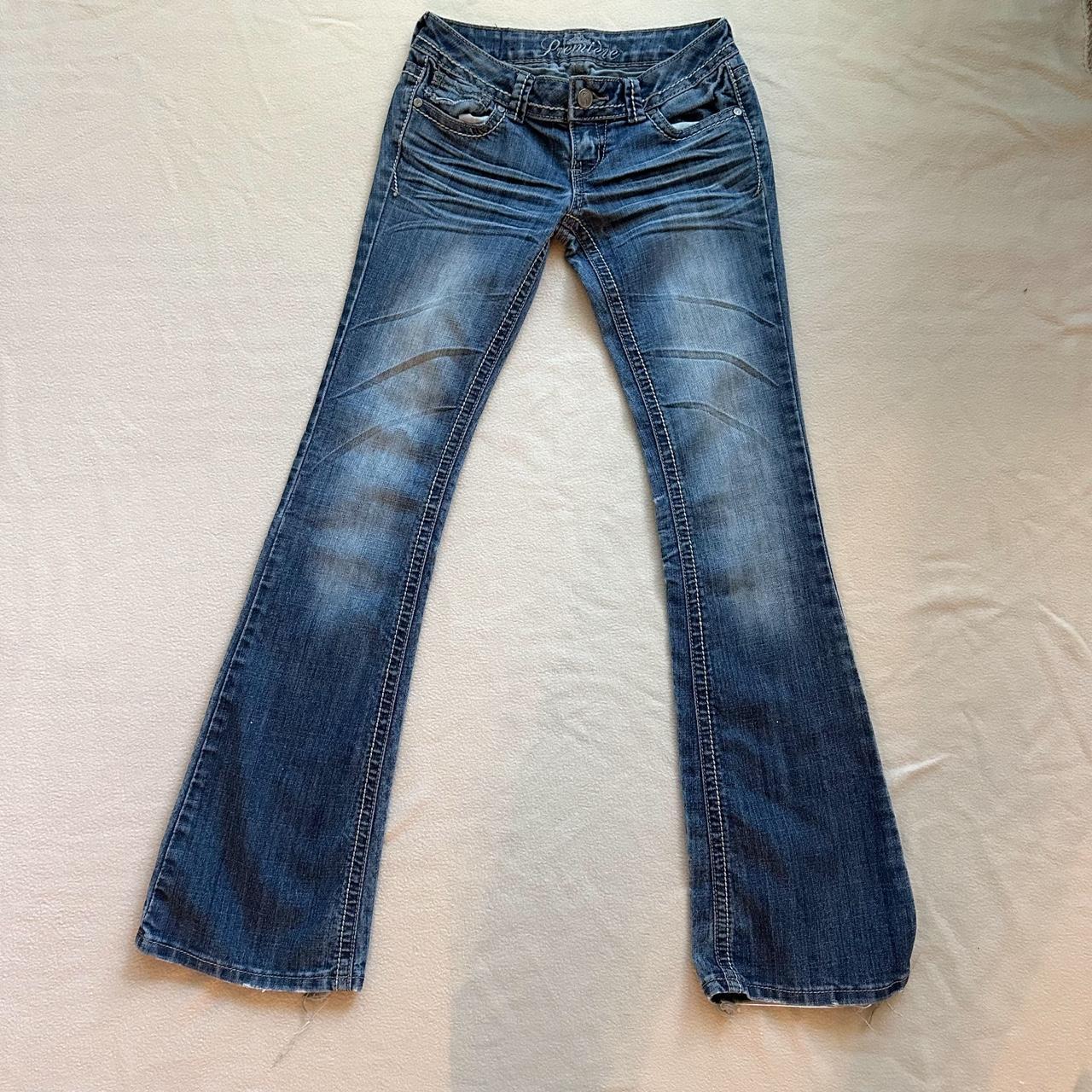 Low rise, flared blue jeans with a distressed look... - Depop