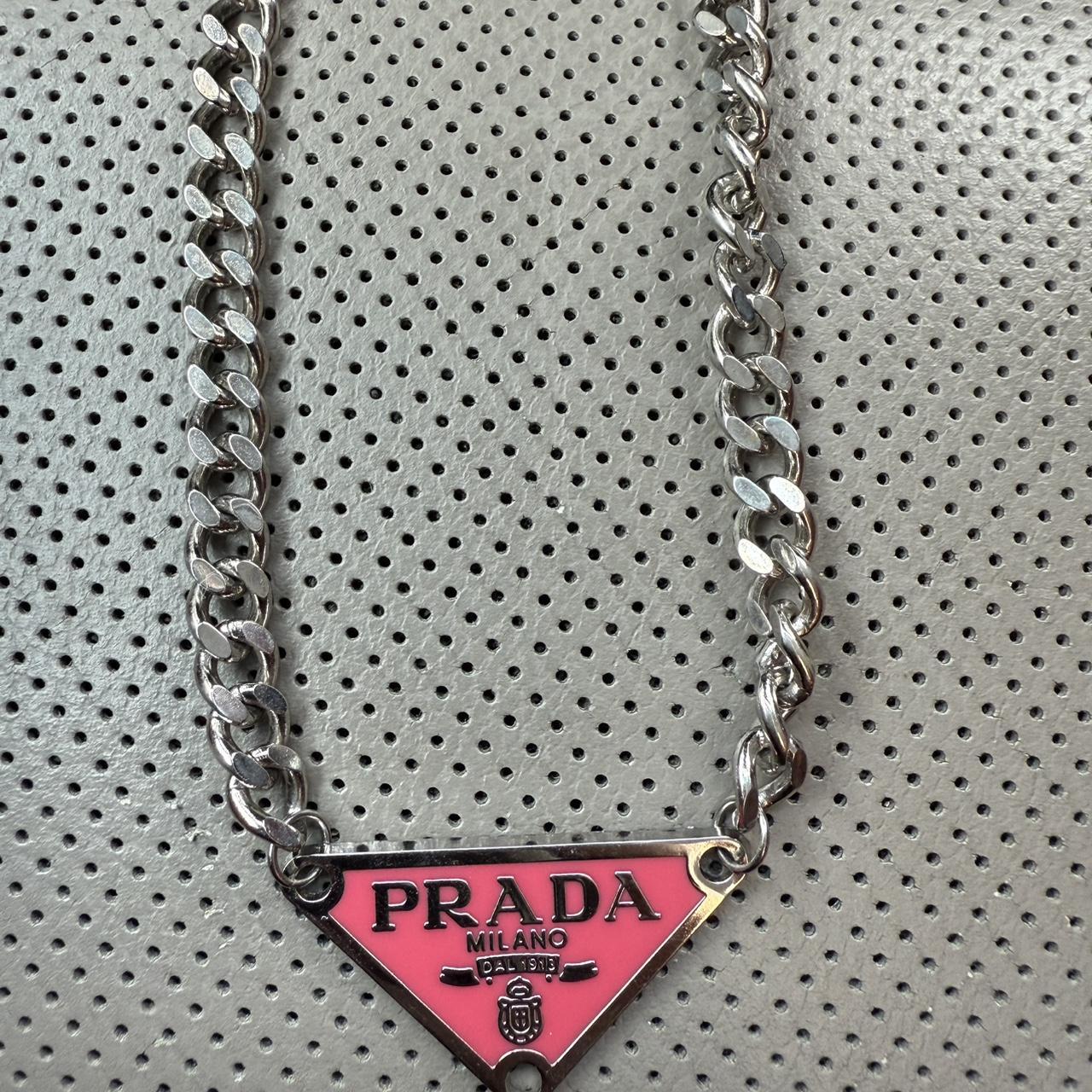 authentic Prada tag with a repurposed chain. Love... | Depop