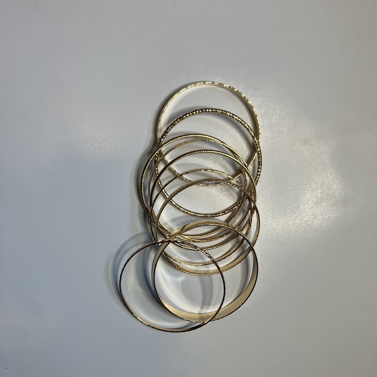 Set of costume gold bangles. Cute, easy to squeeze on. - Depop