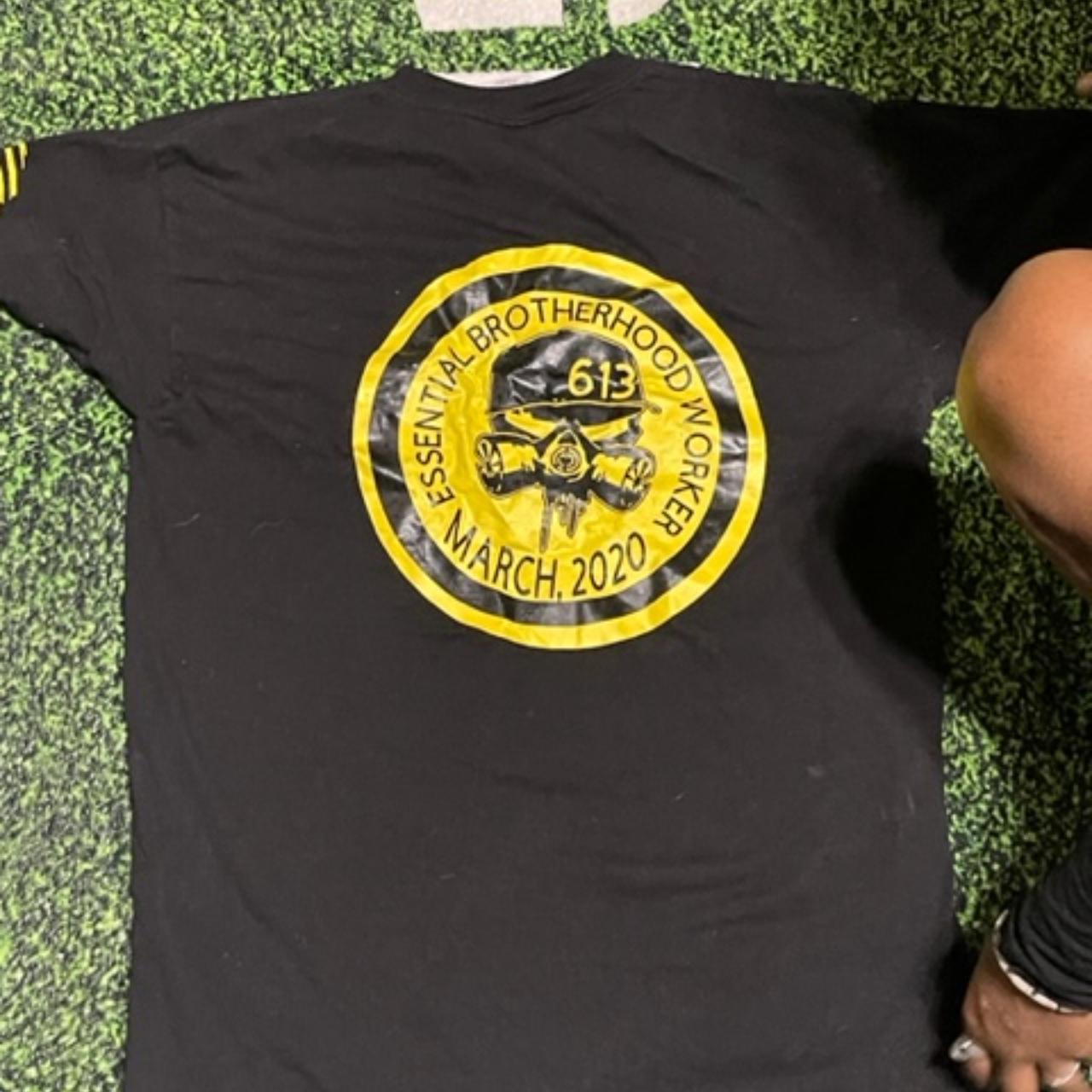 A black and yellow graphic tee with Covid 19... - Depop