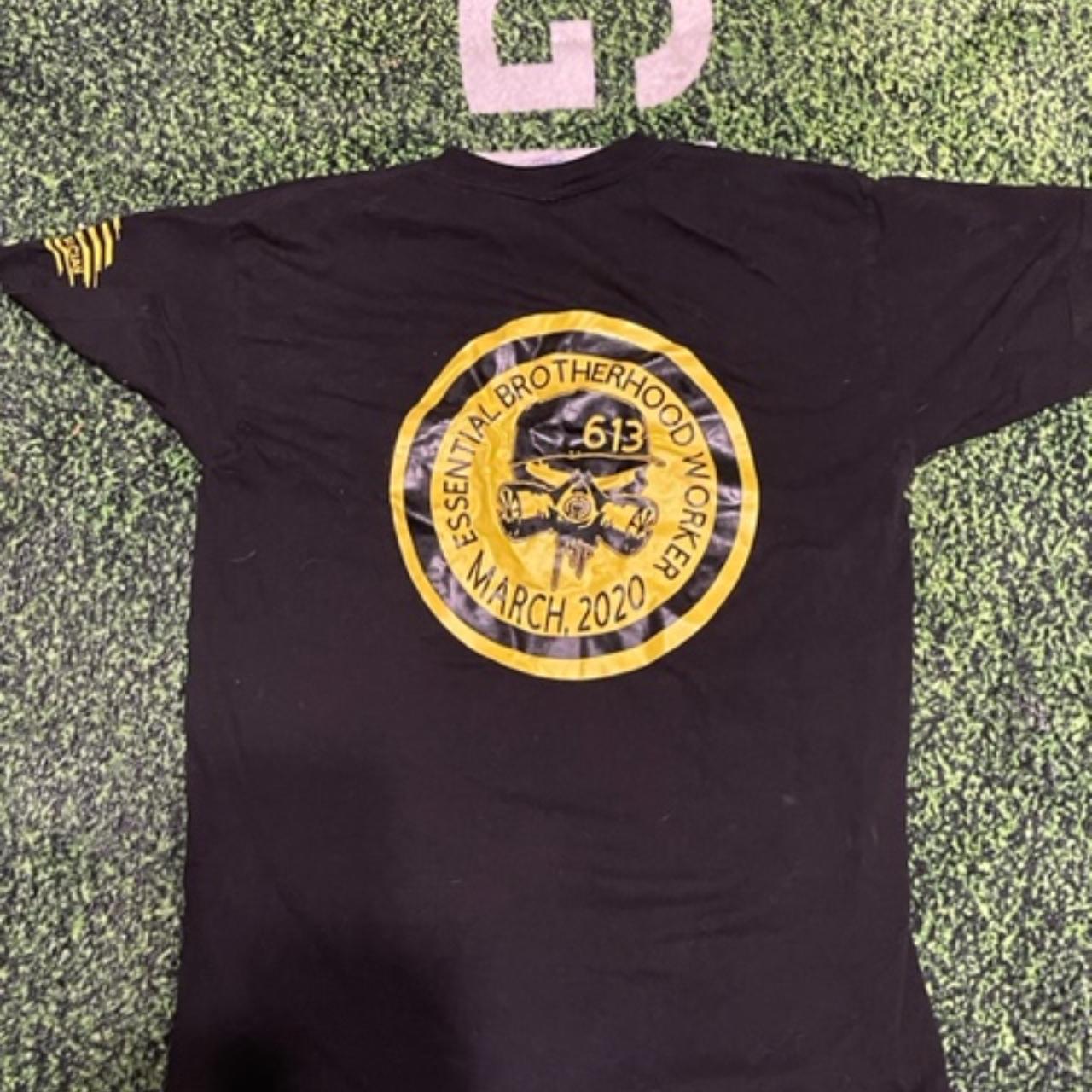 A black and yellow graphic tee with Covid 19... - Depop