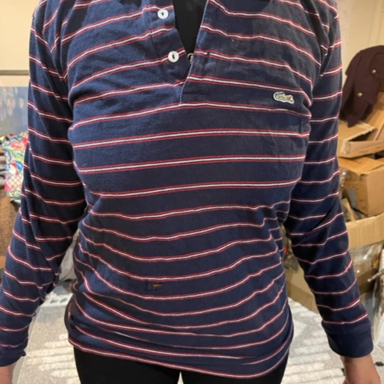 A navy blue with red and white stripes Lacoste... - Depop