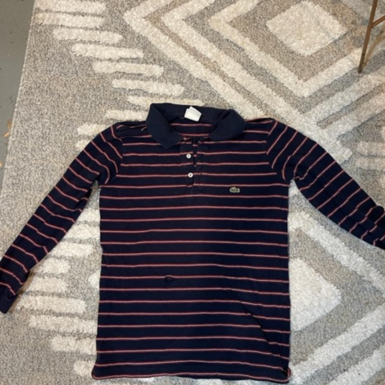 A navy blue with red and white stripes Lacoste... - Depop