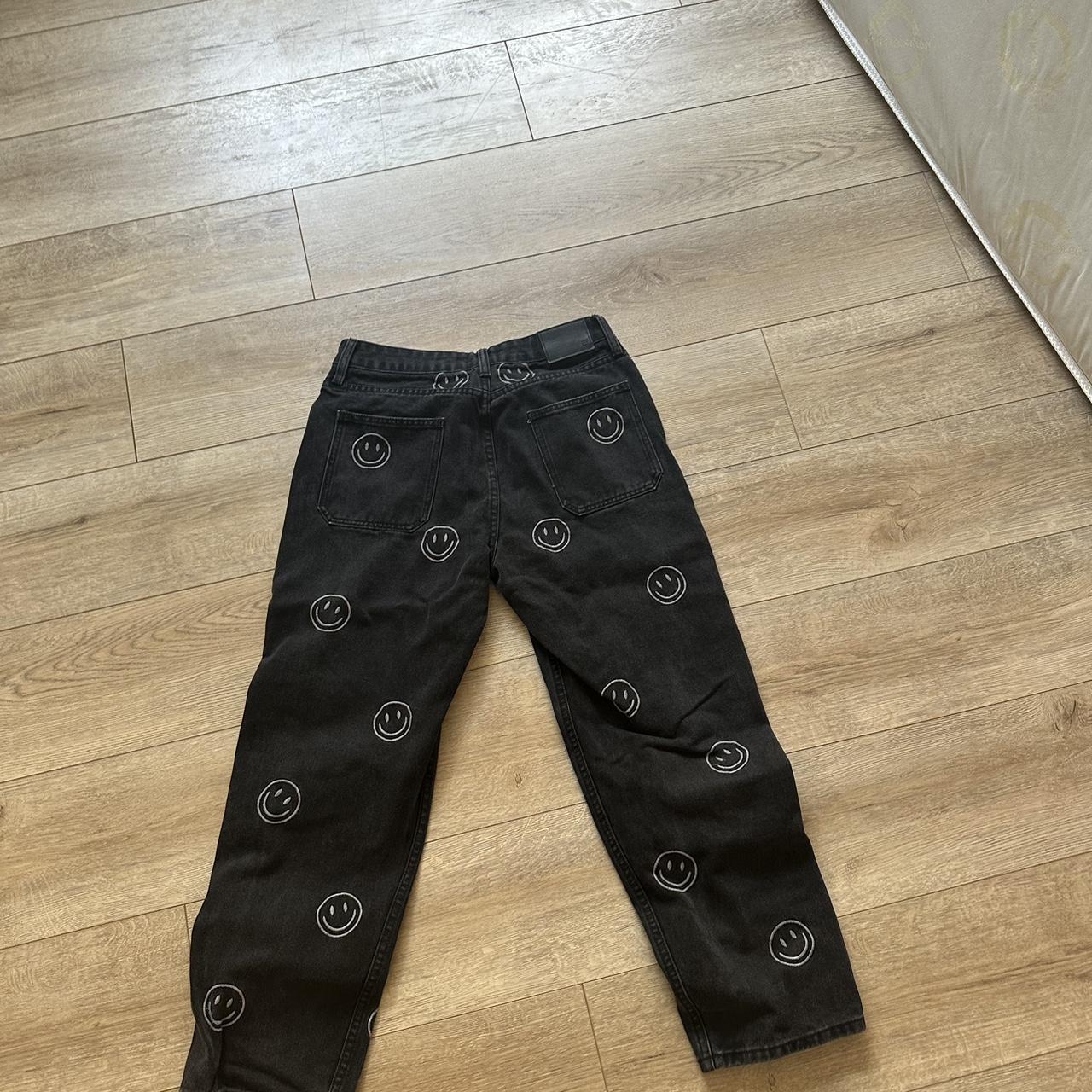 Black smiley face pants - Depop