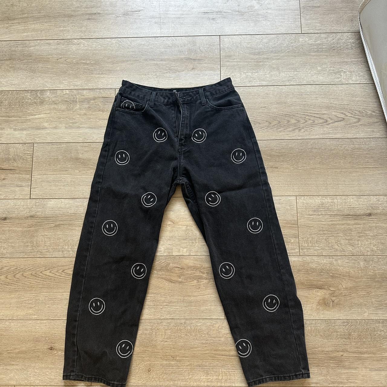 Black smiley face pants - Depop