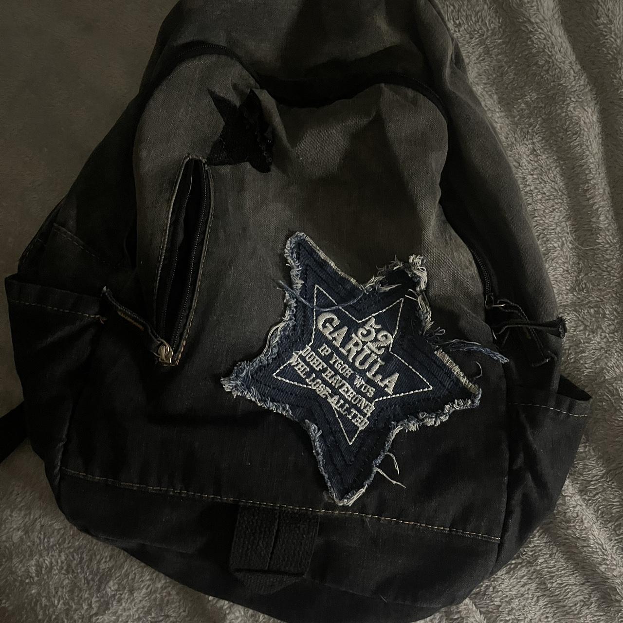 a Jean backpack that’s a cool backpack has a star... - Depop