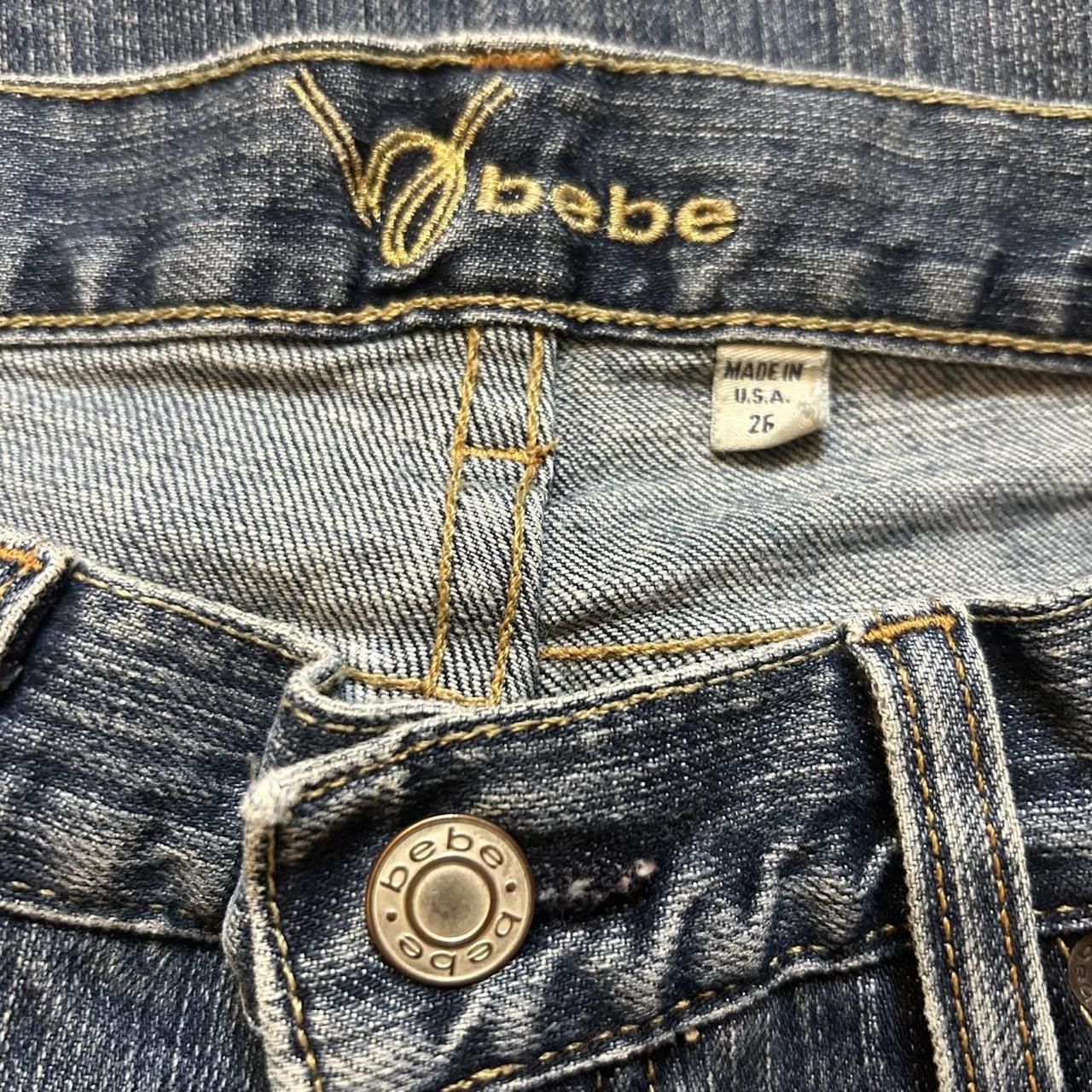 - 00’s Bebe Low rise bootcut jeans with distressed... | Depop