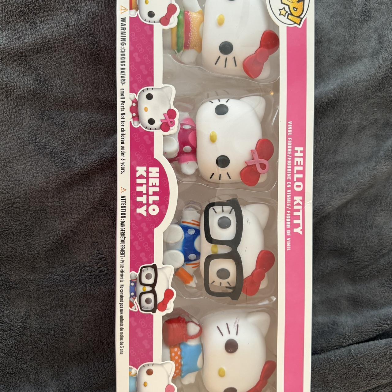 Hello kitty vinyl figures set of four - Depop