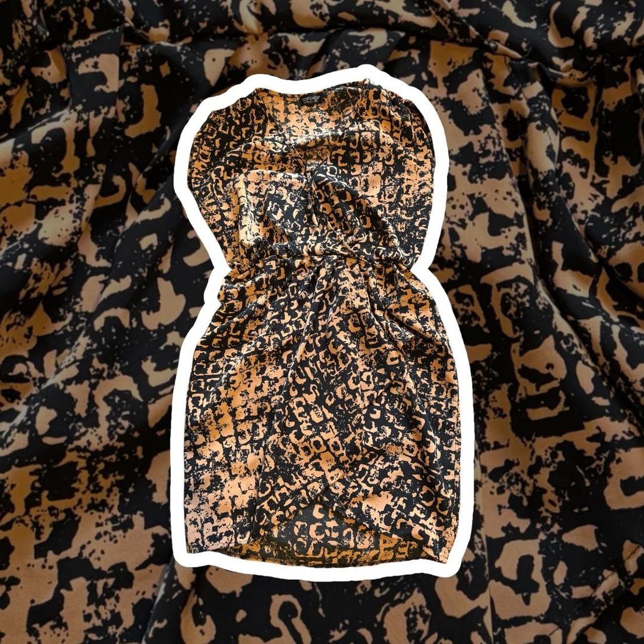 Sleeveless mini dress, small slit like opening on... - Depop