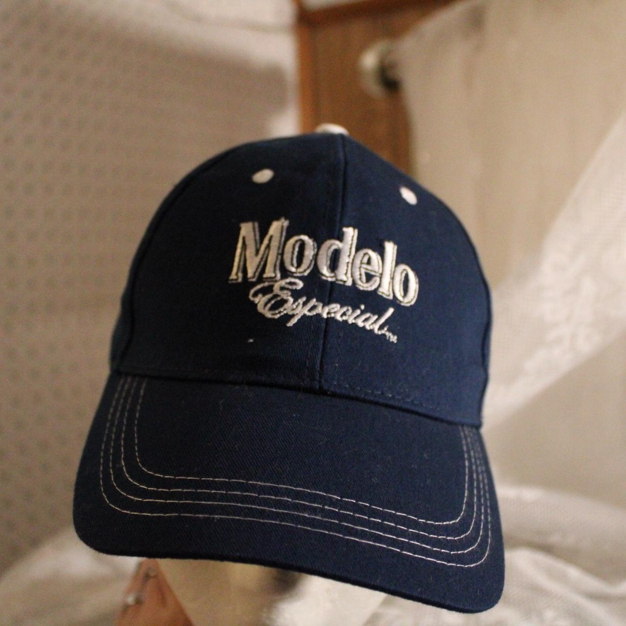 navy blue modelo ball cap, with white stitching and... - Depop