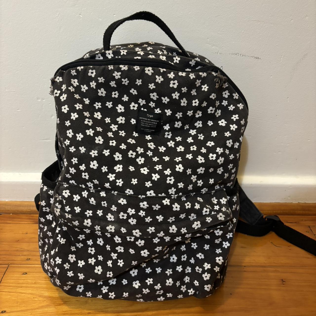 Typo flower black and white backpack with 2 holes on... - Depop
