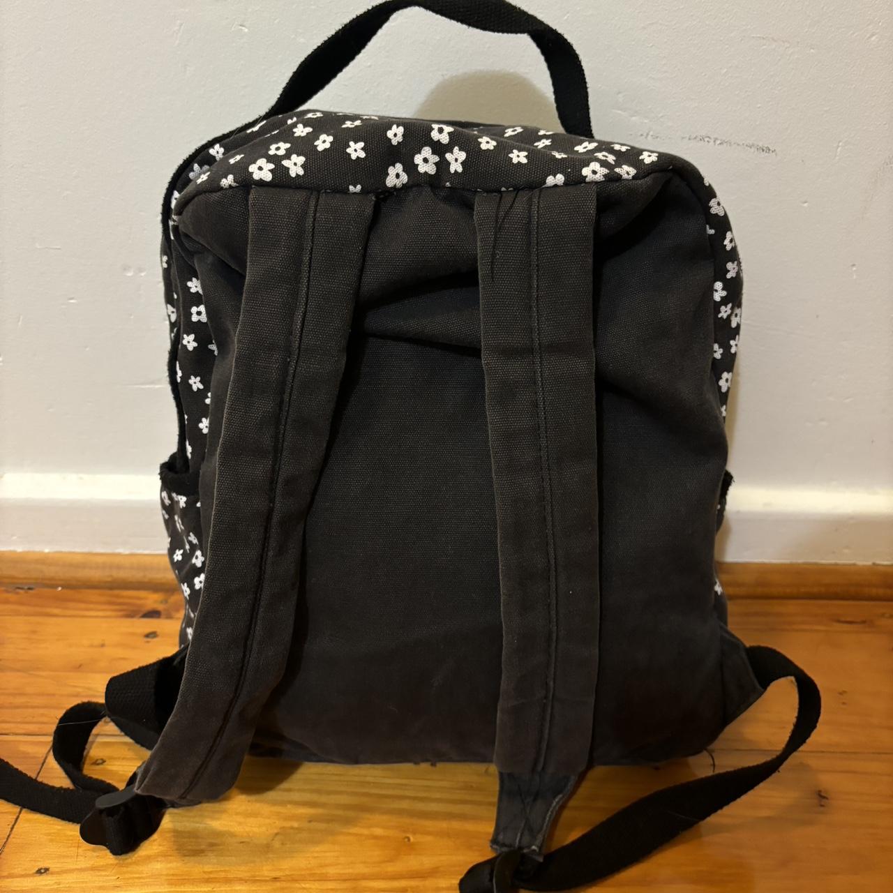 Typo flower black and white backpack with 2 holes on... - Depop