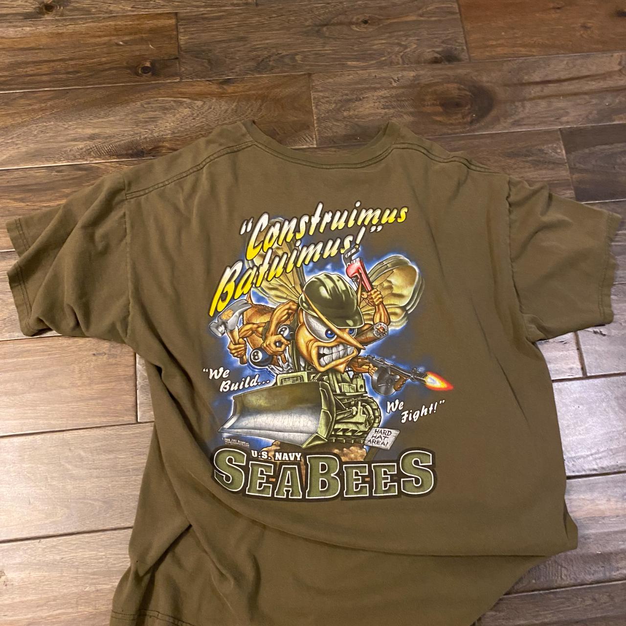 vintage old graphic construction tee has a dark spot... - Depop