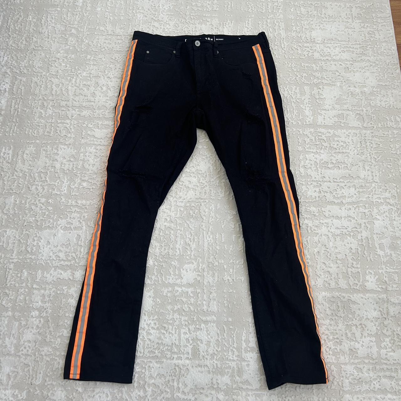 Rogue Territory Men's Ripped Black and Orange Jeans | Depop