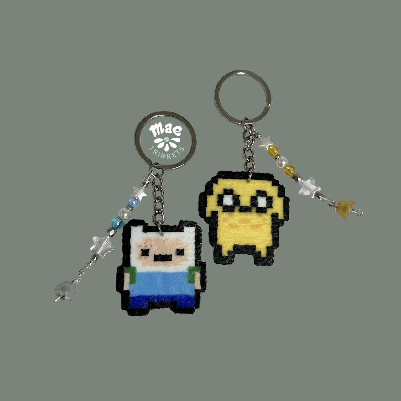 Finn and Jake matching keychains! Finn keychain has... - Depop
