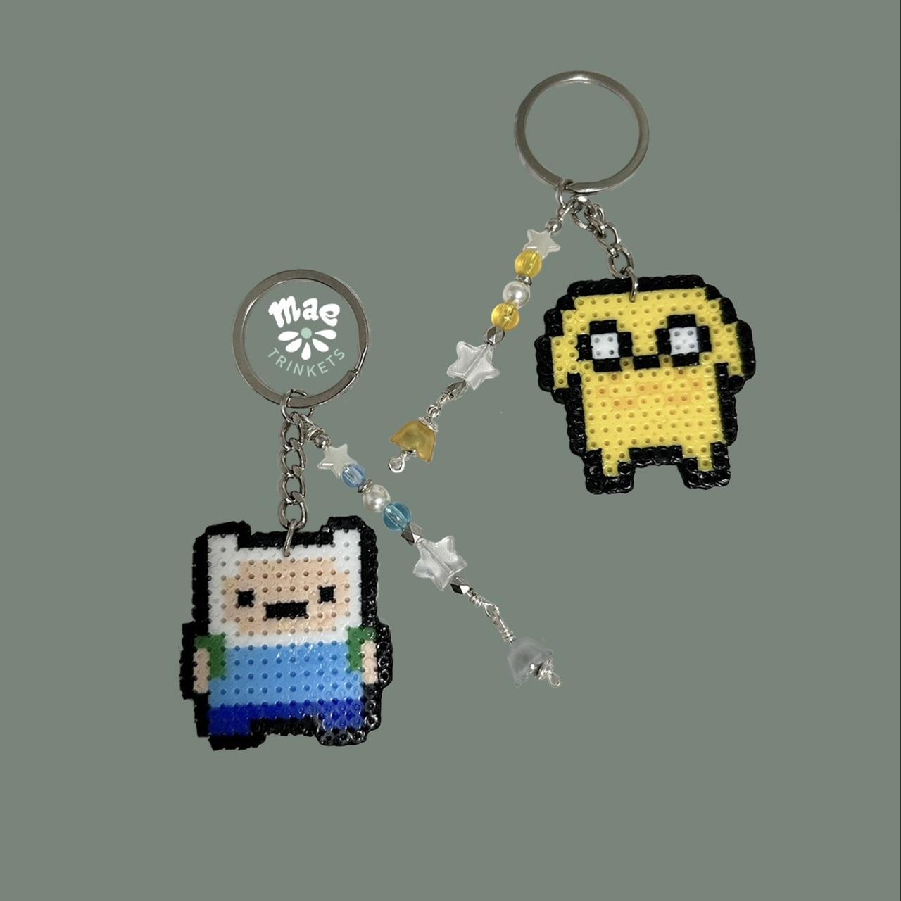 Finn and Jake matching keychains! Finn keychain has... - Depop