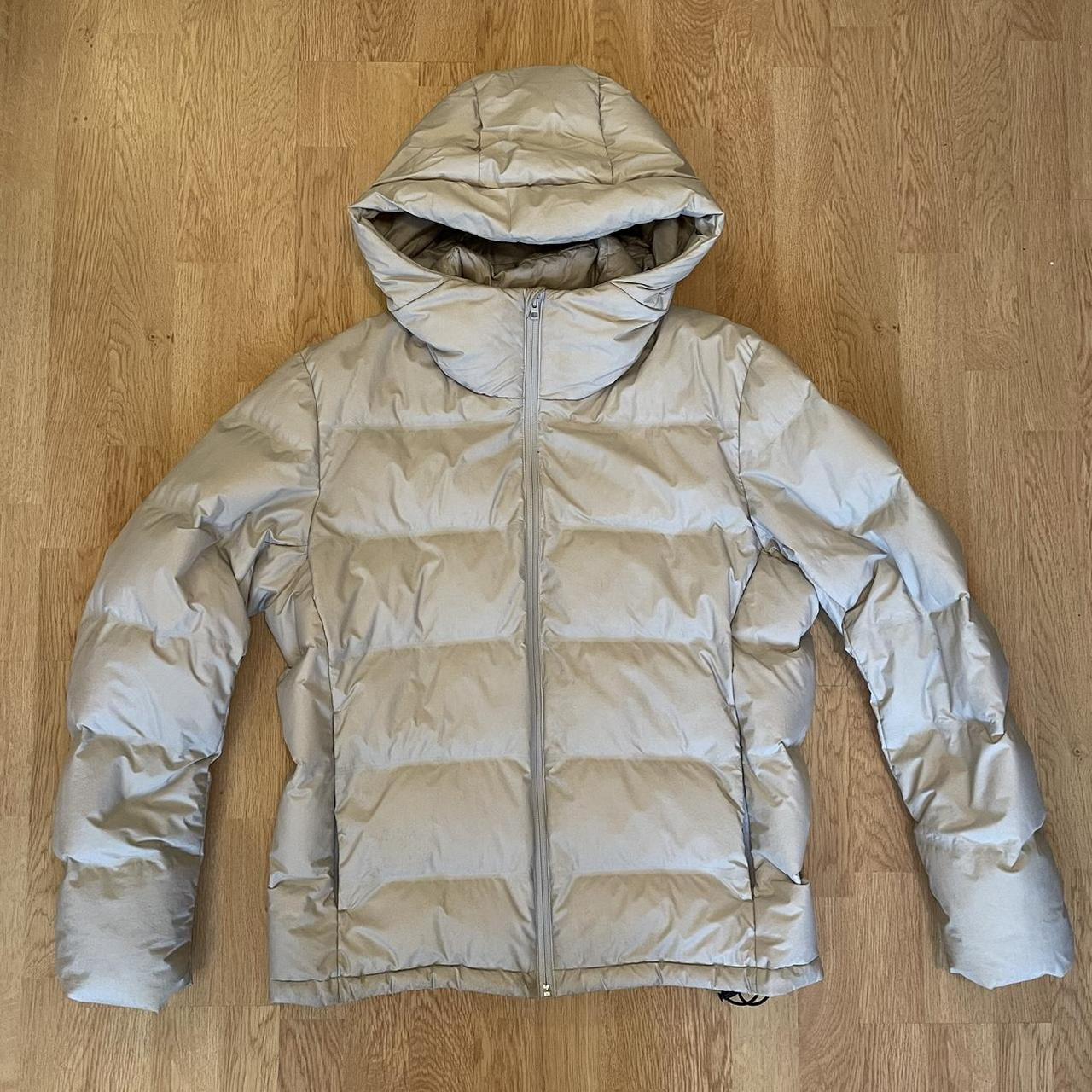 Uniqlo seamless down jacket Cream Well worn, with... - Depop