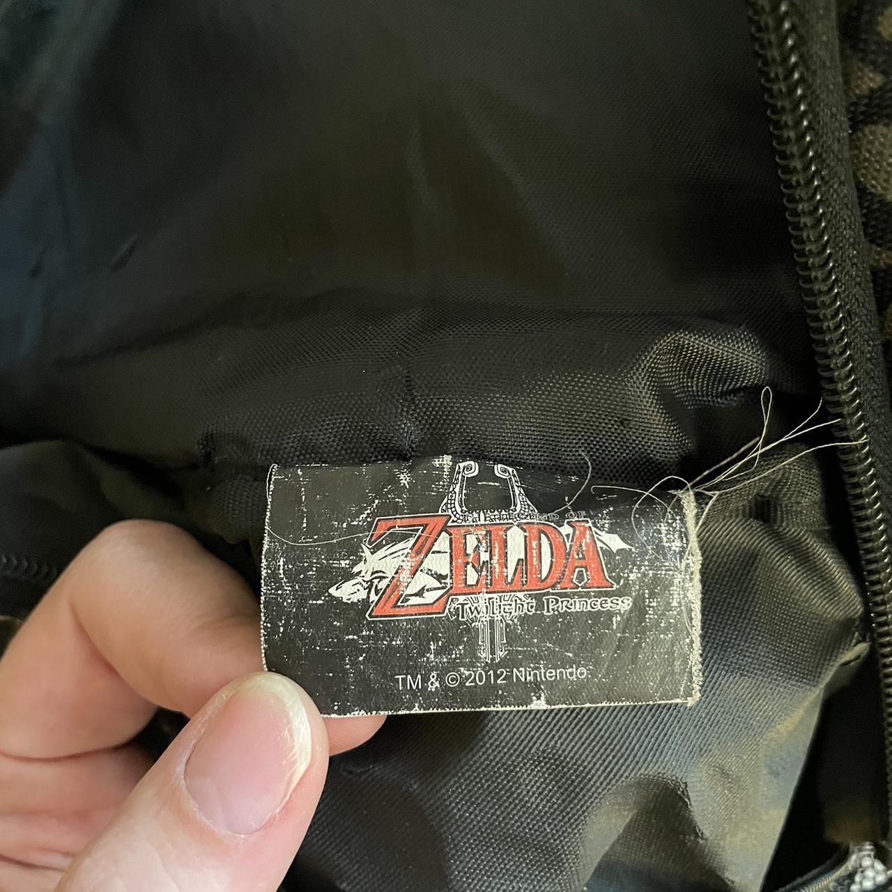 Legend of Zelda black and gold Triforce Backpack 1... | Depop