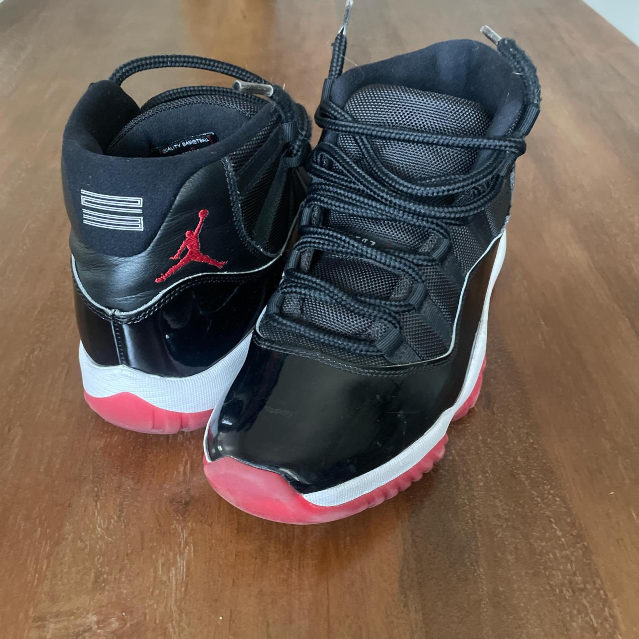 Jordan 11 bred. Missing the tip on one of the laces,... - Depop