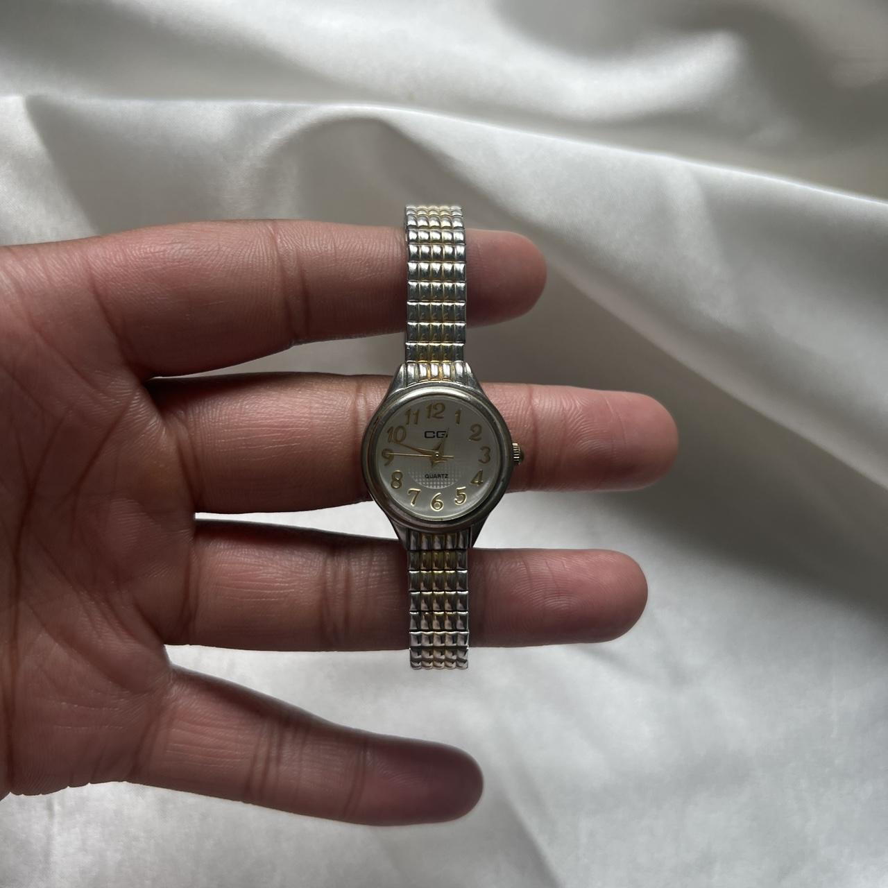 Two Tone CG Quartz Stretch Band Watch Length:... - Depop