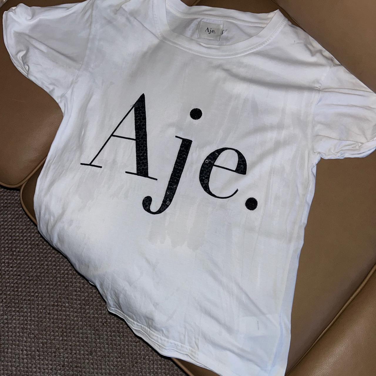 Aje oversized tshirt. Small silverfish hole in the... - Depop