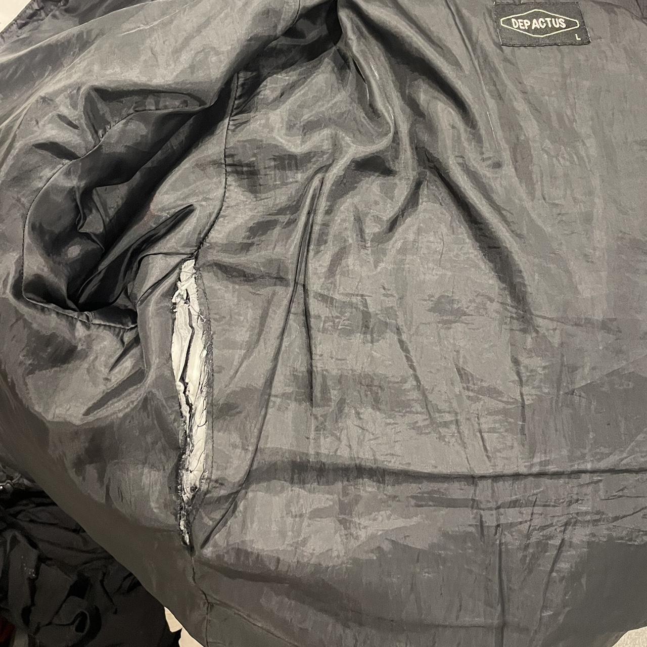 black puffer rip inside but doesn’t affect it. - Depop