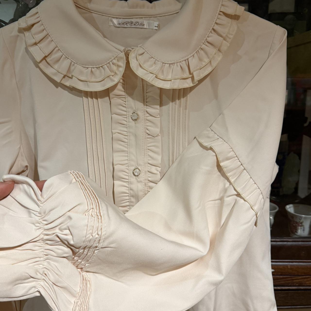 Cream blouse with ruffles and intricate... | Depop