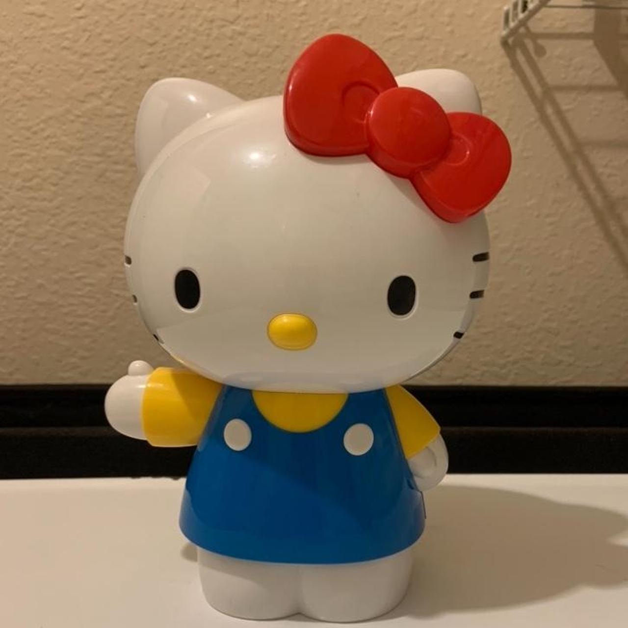 Hello kitty waving toy the button on the back makes... | Depop