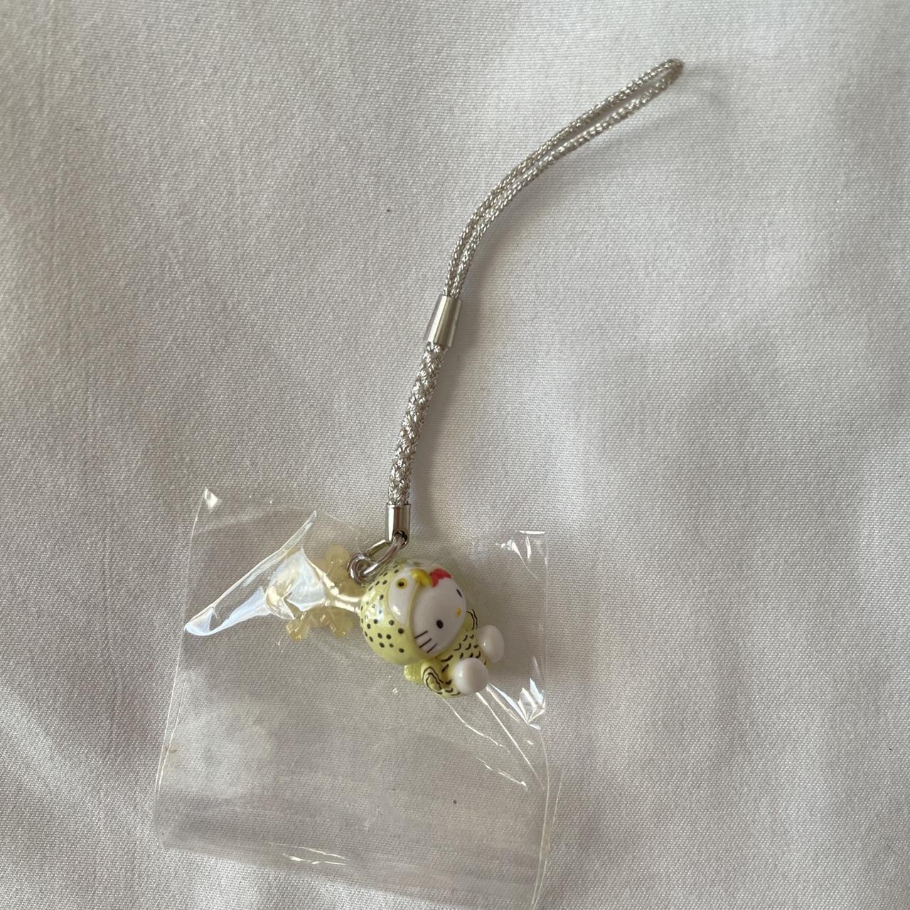🦉HELLO KITTY OWL GOTOCHI CHARM🦉 has a snowflake... - Depop