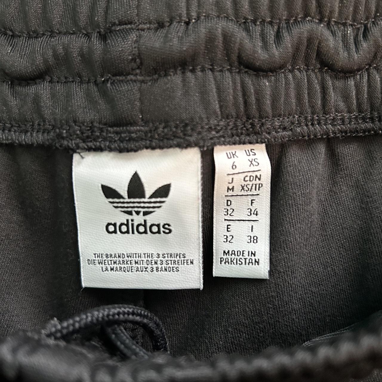adidas black and white track pants -has zippers on... - Depop