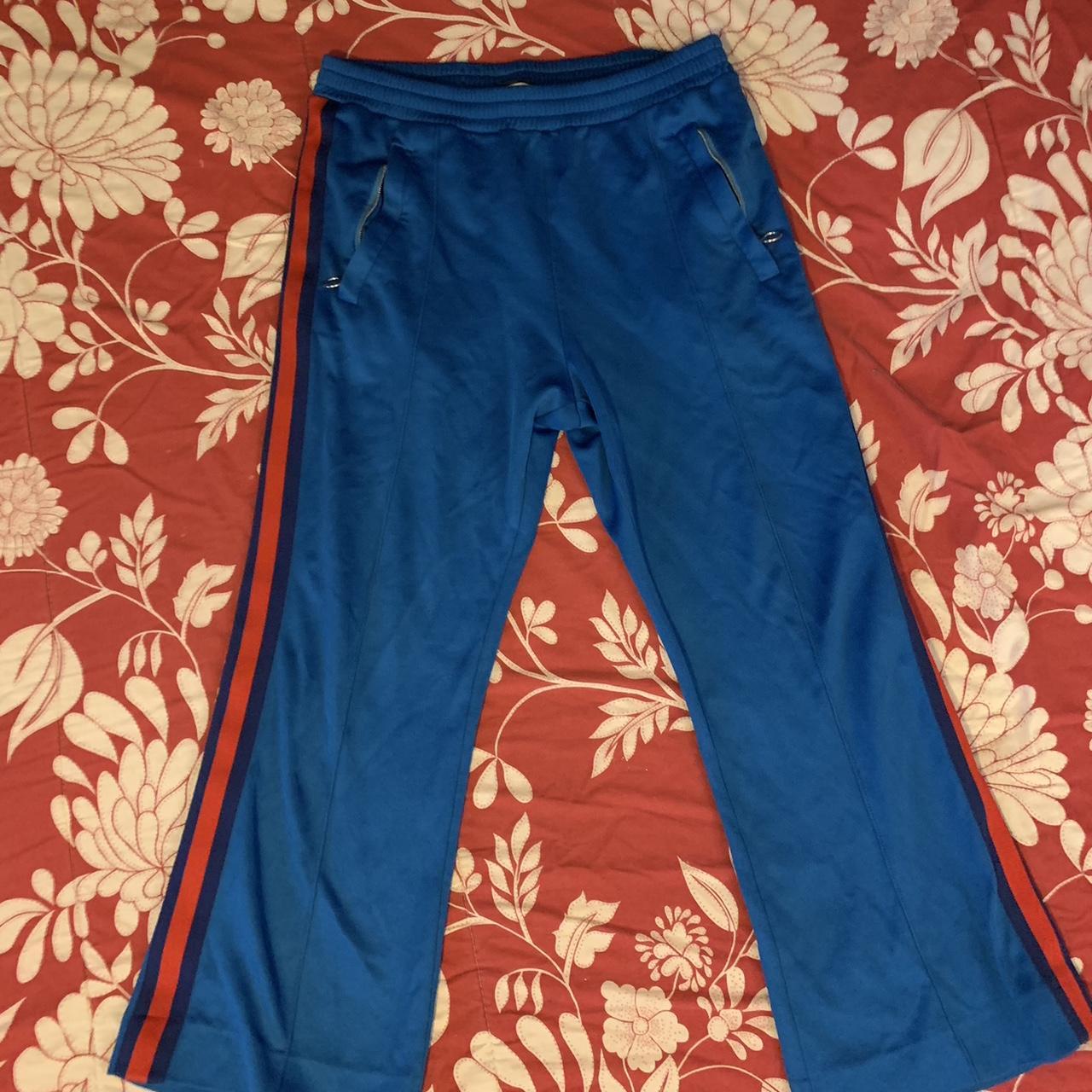 These are blue Gucci track pants made of polyester... | Depop