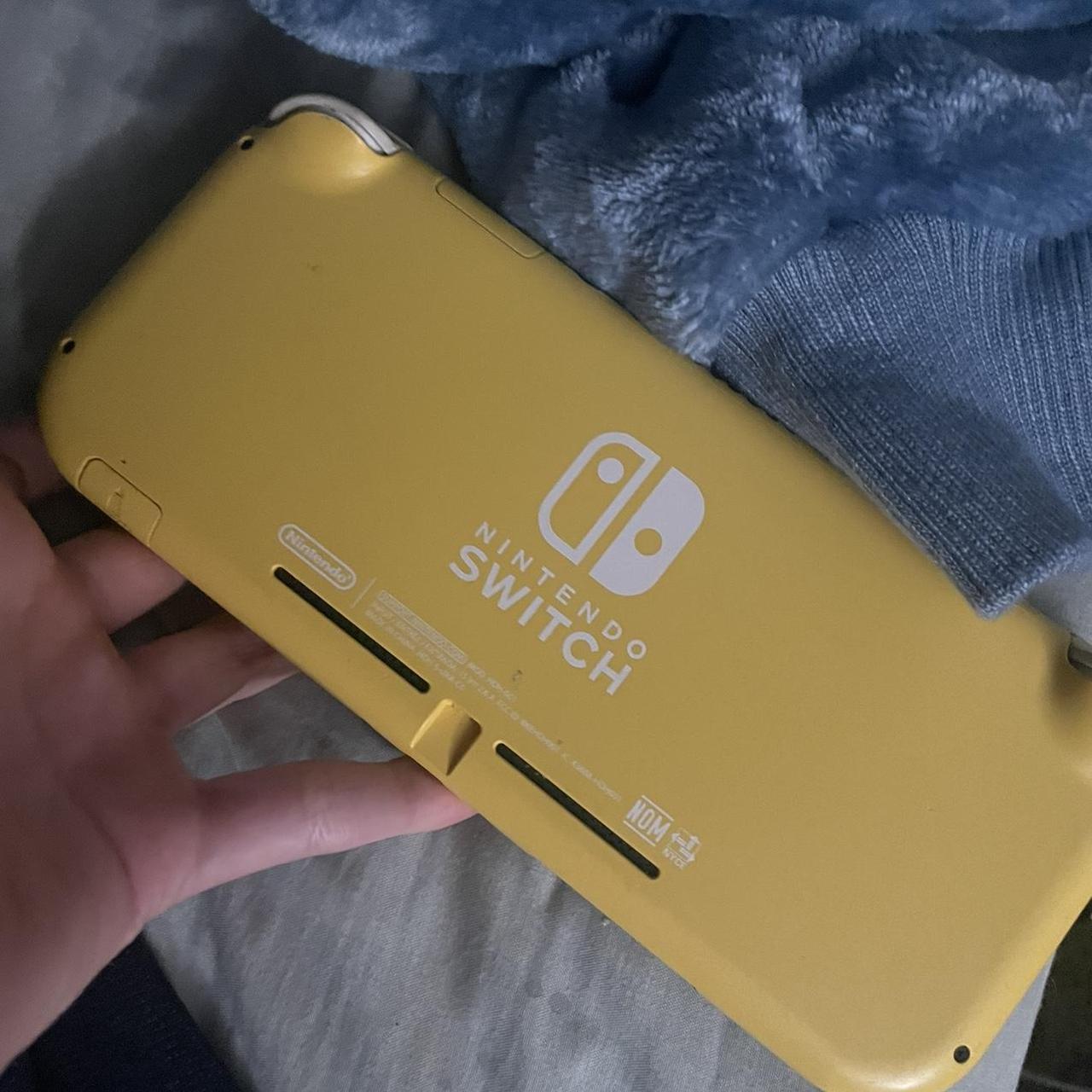 Handheld yellow nintendo switch (no longer... - Depop