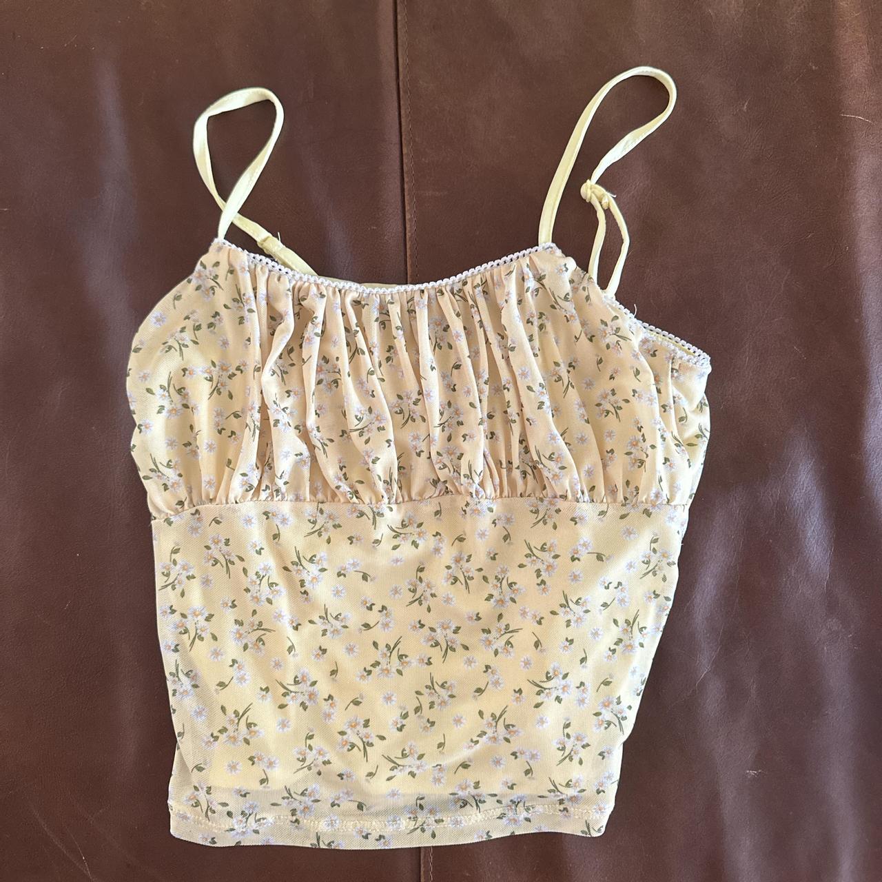 Small yellow tank, kinda cropped No stains or tears... - Depop