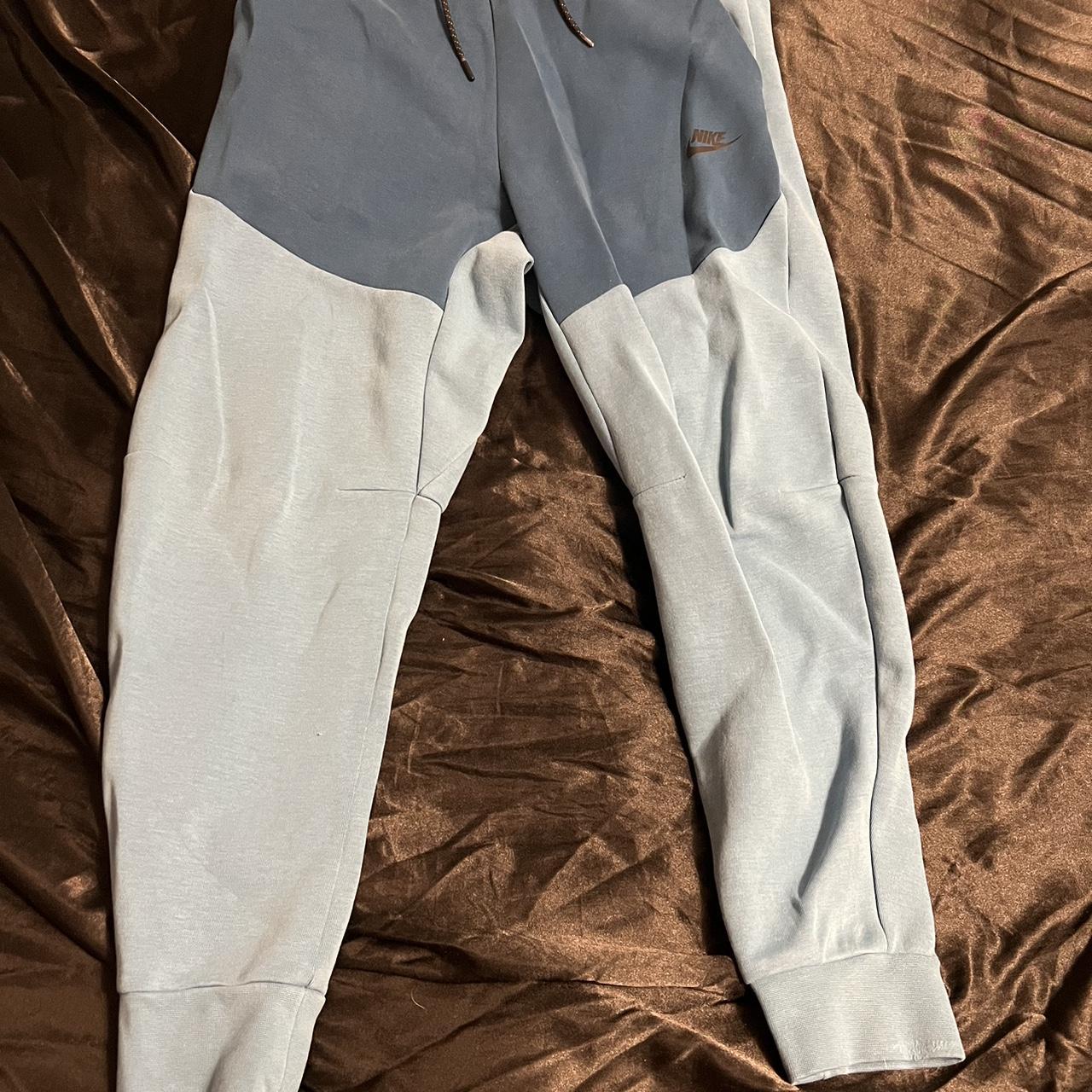 Blue Nike tech pants size large - Depop
