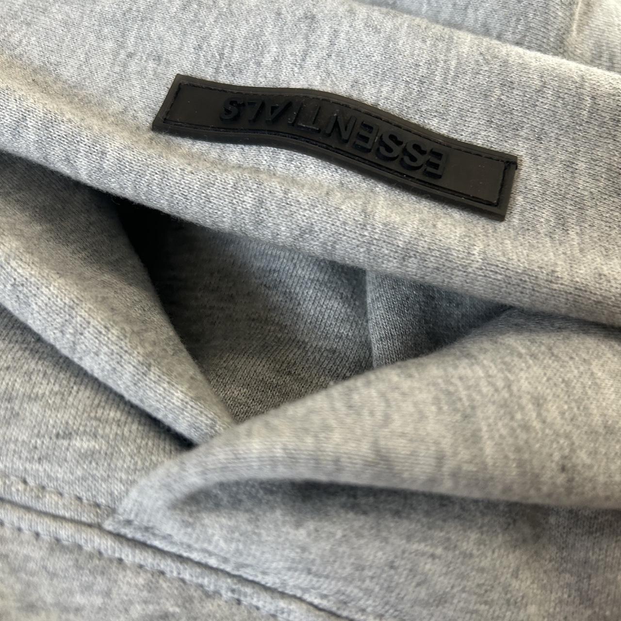 Essentials hoodie dark gray - Depop