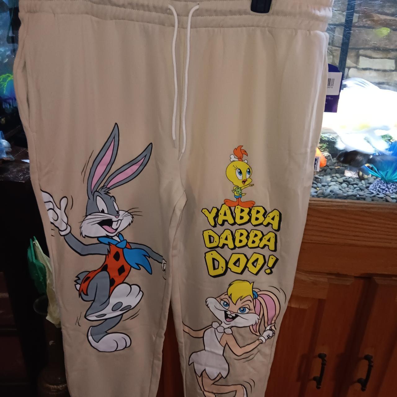 This stylish pair of unisex sweatpants from Warner... - Depop