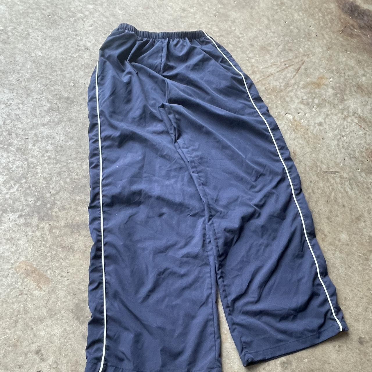 Navy blue polyester sweatpants with white stripe... | Depop