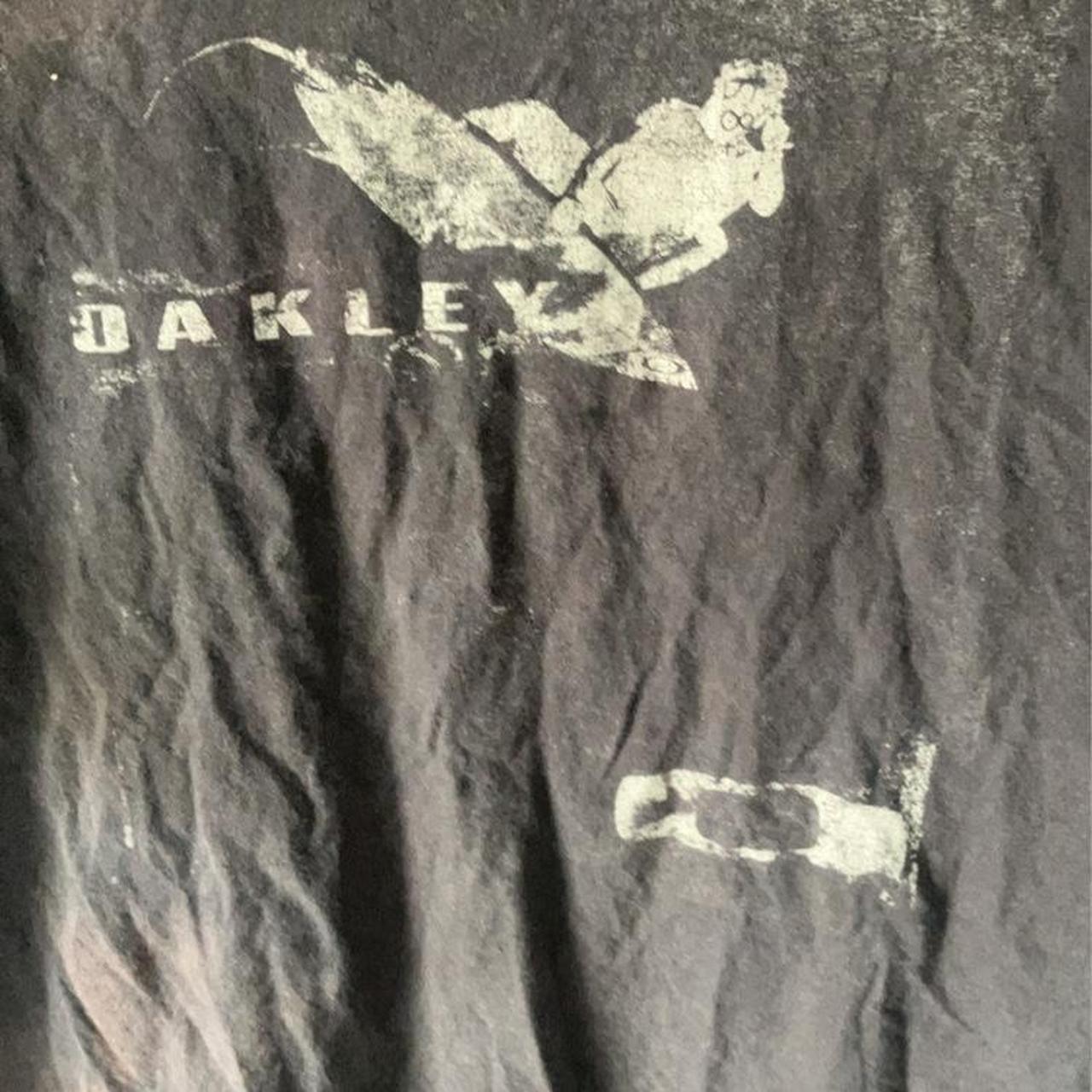 2000's y2k oakley shirt with some bleach stains at... - Depop