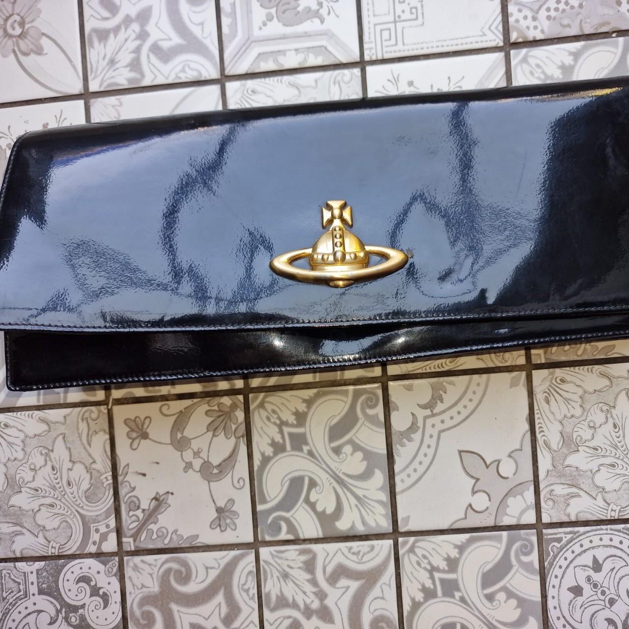 Vivienne westwood clutch bag. Does have a few marks... - Depop