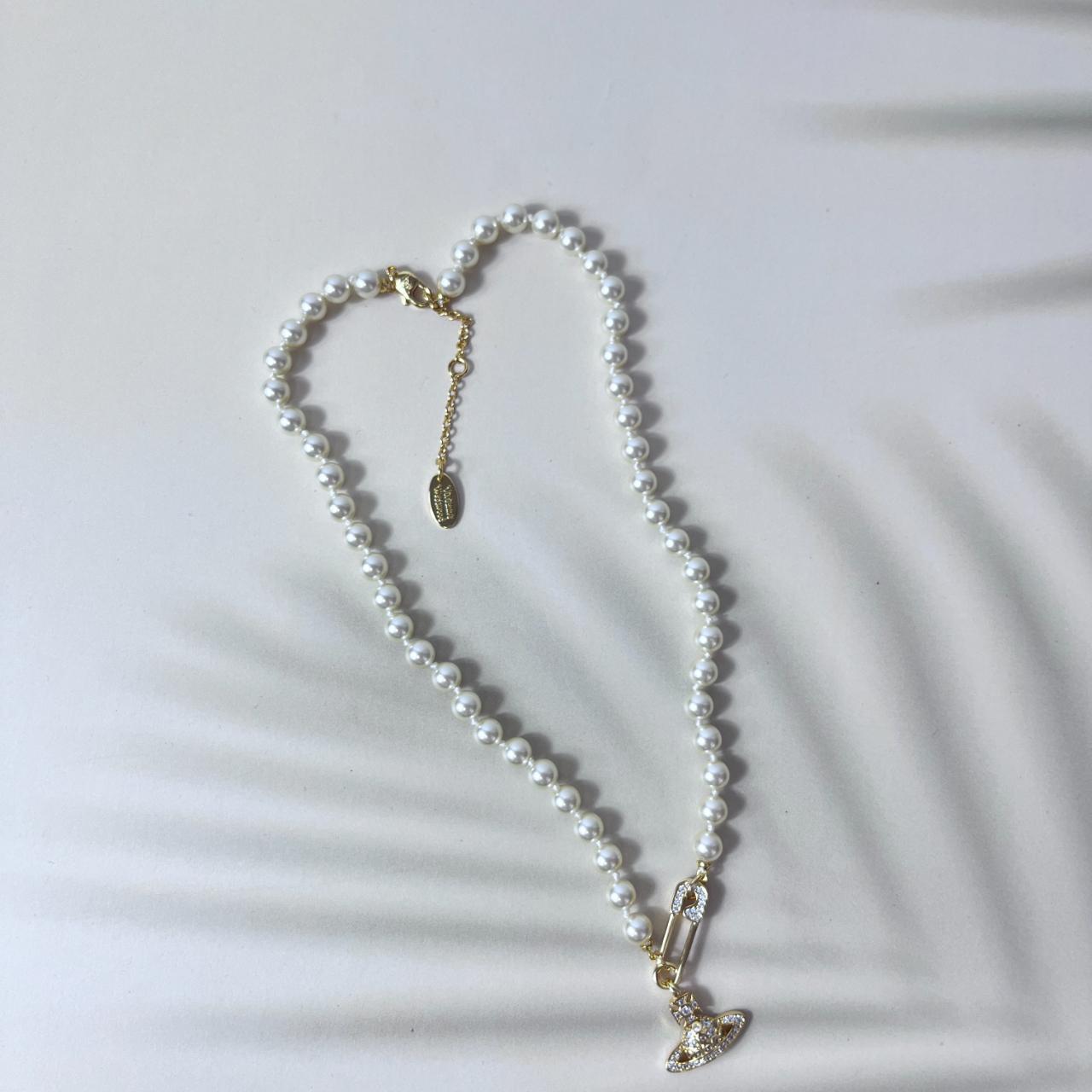 Gold Saturn pin pendant pearl necklace - Depop