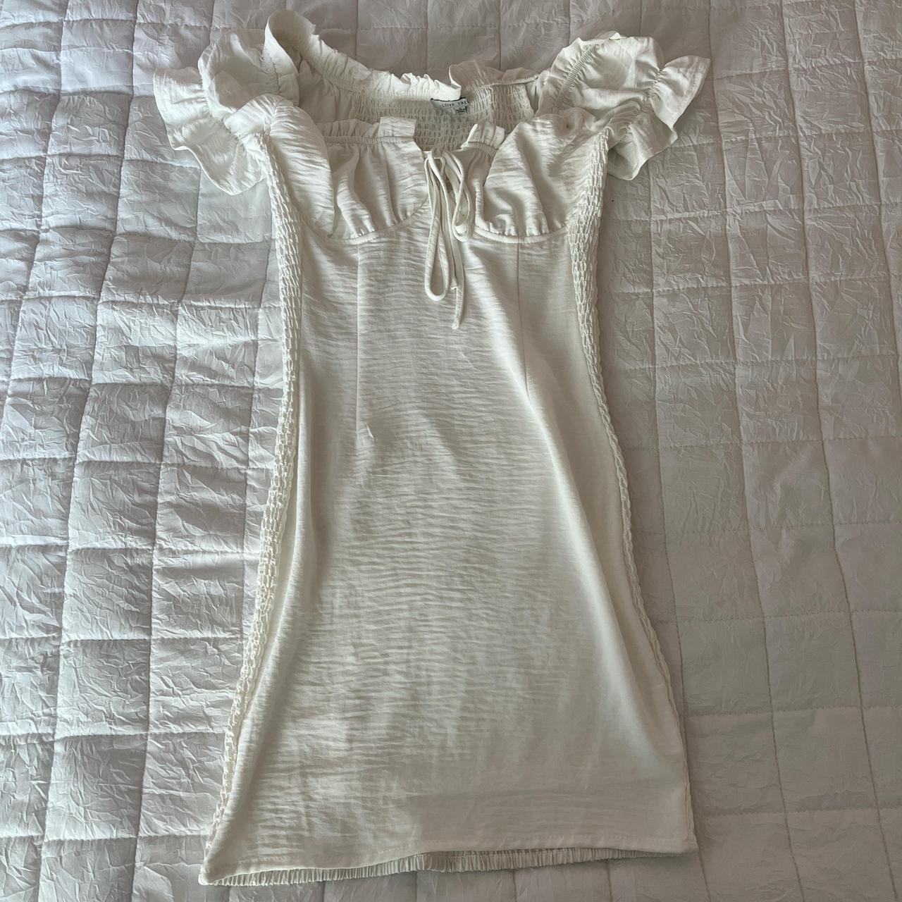 Super cute white mini dress with ruffles and ties in... - Depop
