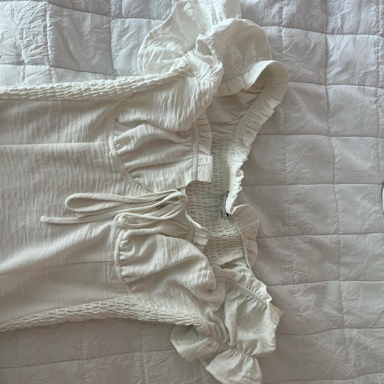 Super cute white mini dress with ruffles and ties in... - Depop