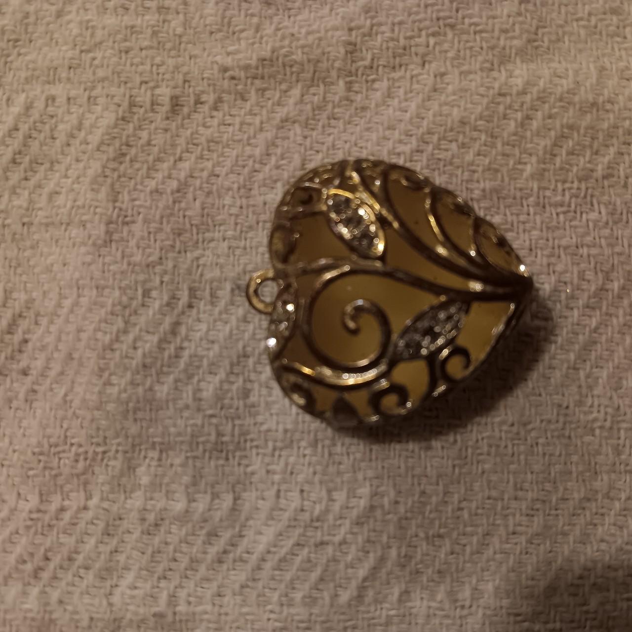 This Is a puff locket super pretty and reto looking... - Depop