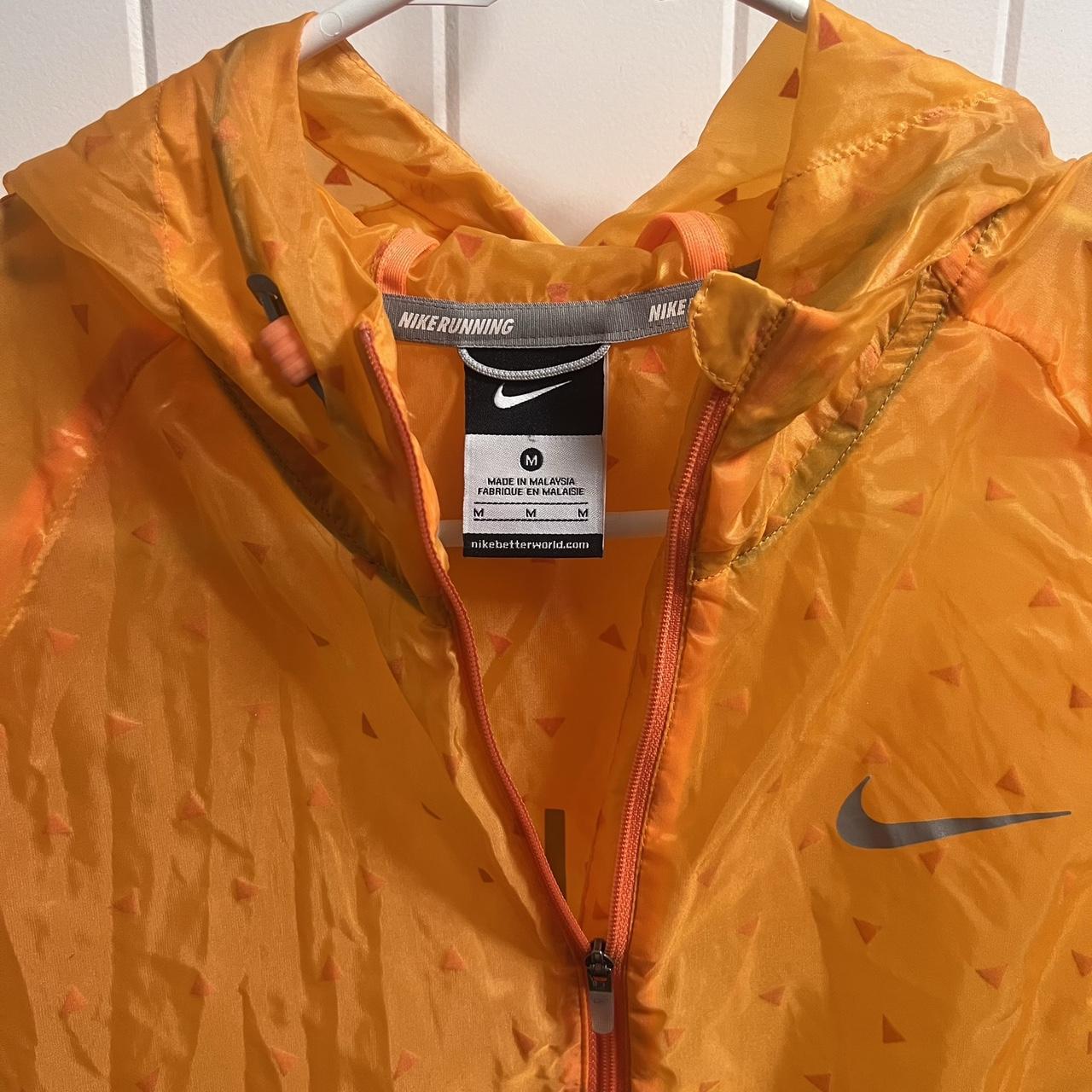 Nike running, neon orange light weight rain... - Depop