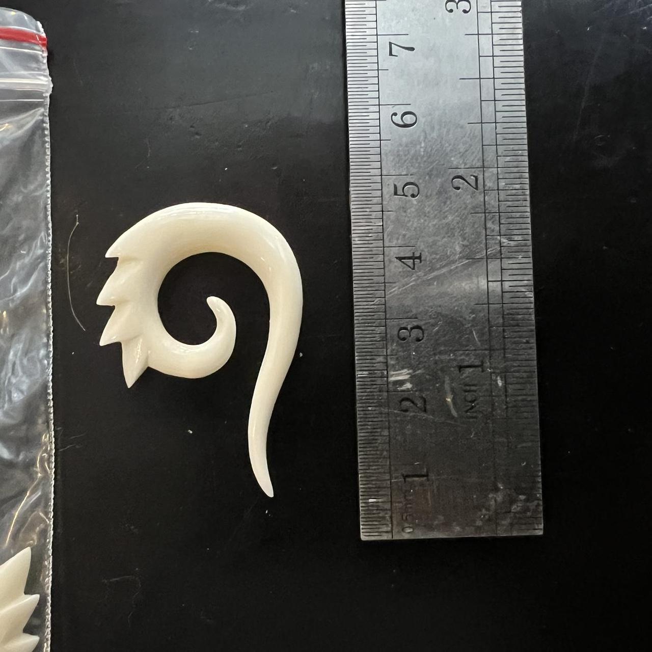 Unique White carved bone gauge spiral earrings with... | Depop