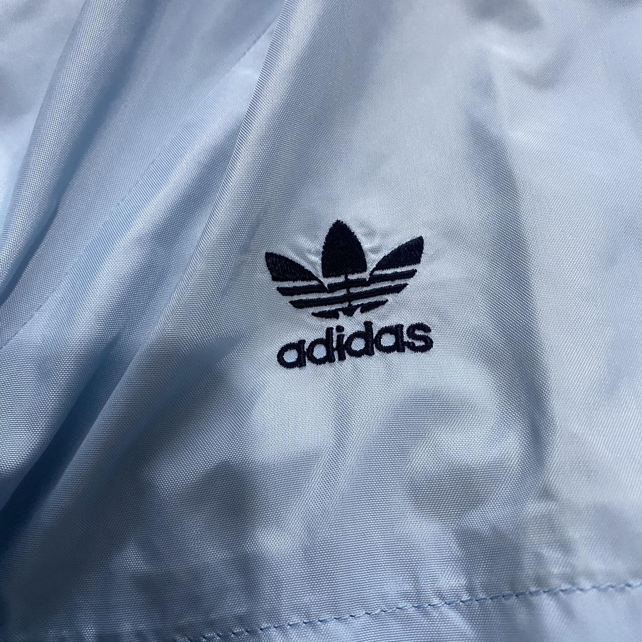 Adidas Originals light blue track jacket with a... - Depop