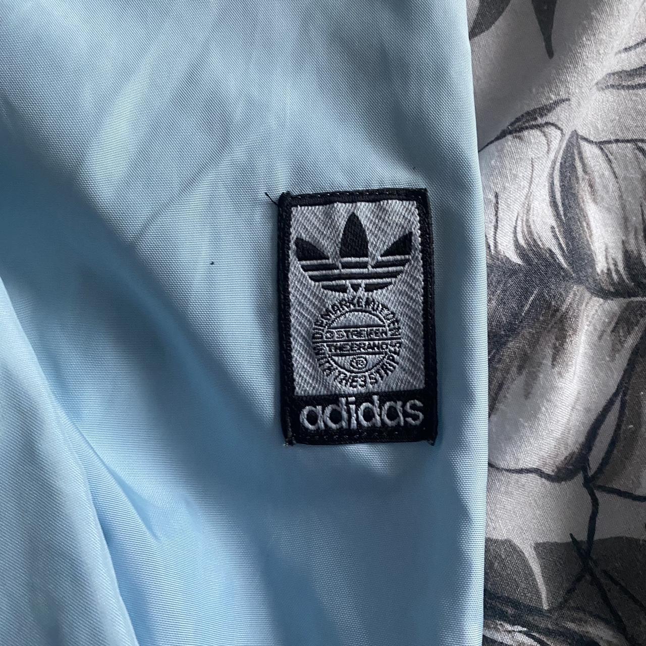 Adidas Originals light blue track jacket with a... - Depop
